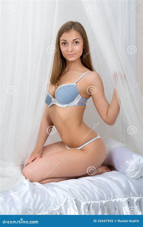 Charming Girl In Underwear Sitting On A Bed Stock Image Image Of