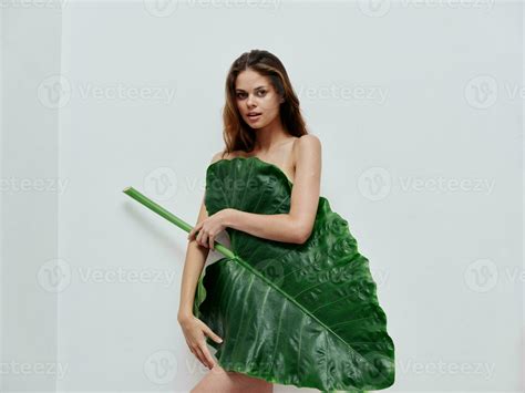 Red Haired Woman With Naked Body Covered With Palm Leaf Exotic Light