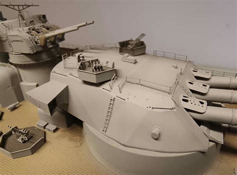 Some Model Tanks And Other Items On A Table