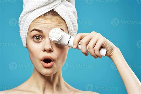 Woman With Towel On Head Naked Shoulders Massager Cosmetology Skin Care