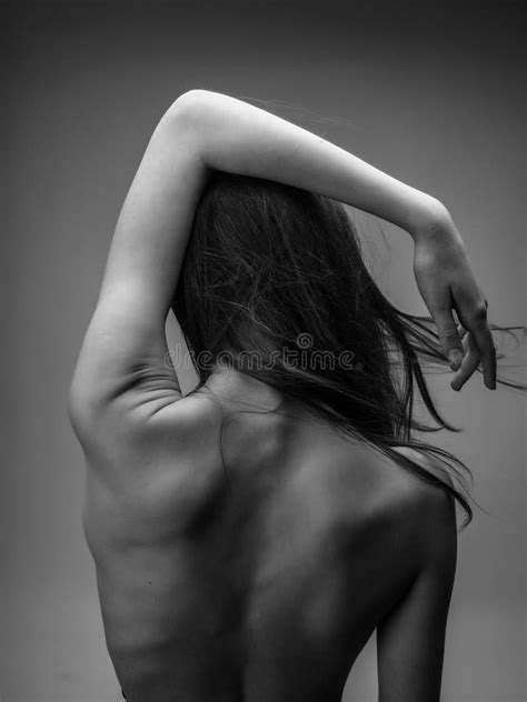 Back Of A Woman Naked Body Posing Black And White Photo Stock Photo