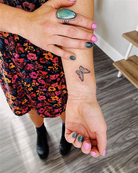 Small Butterfly Tattoo Located On The Wrist