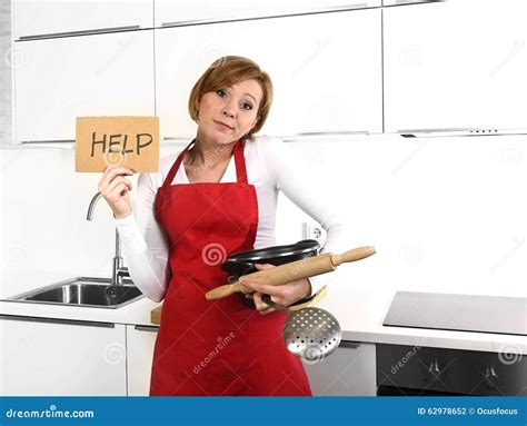 Beautiful Cook Woman In Sad And Frustrated Face Expression Wearing Red Apron Asking For Help
