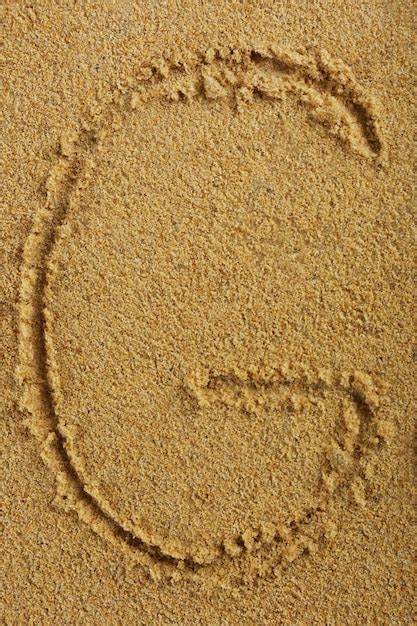Premium Photo Alphabet Letter Written On Wet Beach Sand