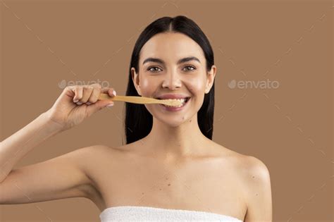 Portrait Of Attractive Cheerful Naked Woman Brushing Her Teeth Stock