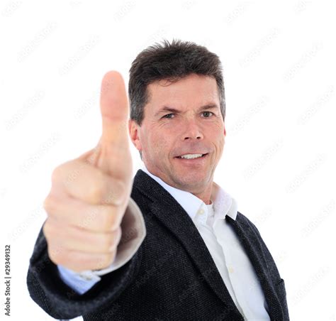 Geschäftsmann zeigt mit dem Daumen nach oben Stock Photo Adobe Stock