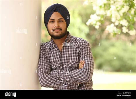 Portrait Of A Man Leaning Against A Pole Stock Photo Alamy
