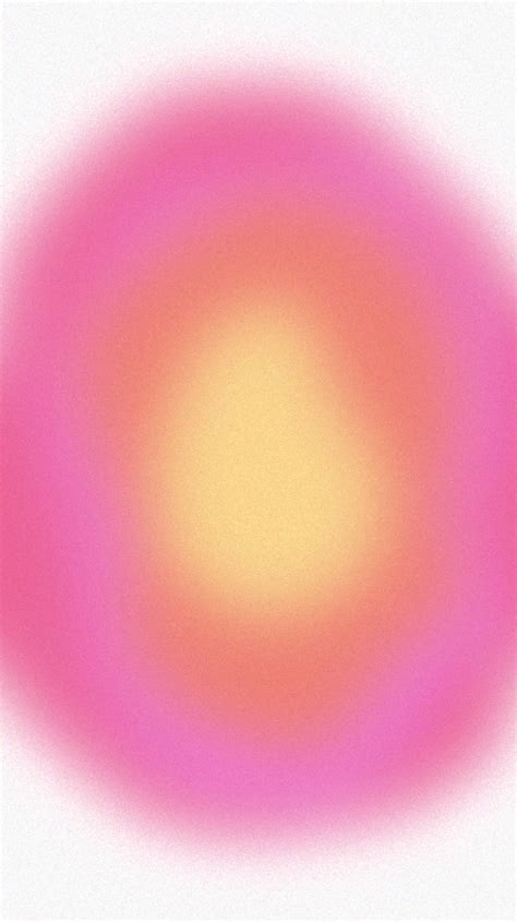 A Blurry Image Of An Orange And Pink Circle On A White Background Is Shown