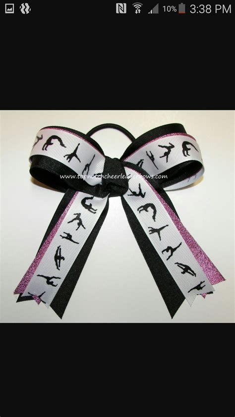 A Black And White Ribbon With Gymnastics Designs On It