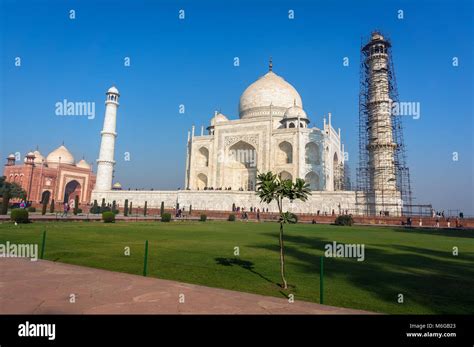 The Taj Mahal Is An Ivory White Marble Mausoleum On The South Bank Of