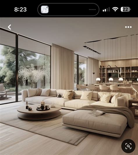 A Living Room Filled With Lots Of White Furniture