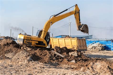 Premium Photo A Excavator Bulldozer Digging Dirt Ground Shoveling