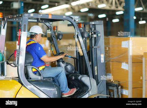 Forklift Are Loading Into Cargo Containers At Warehouses Ports