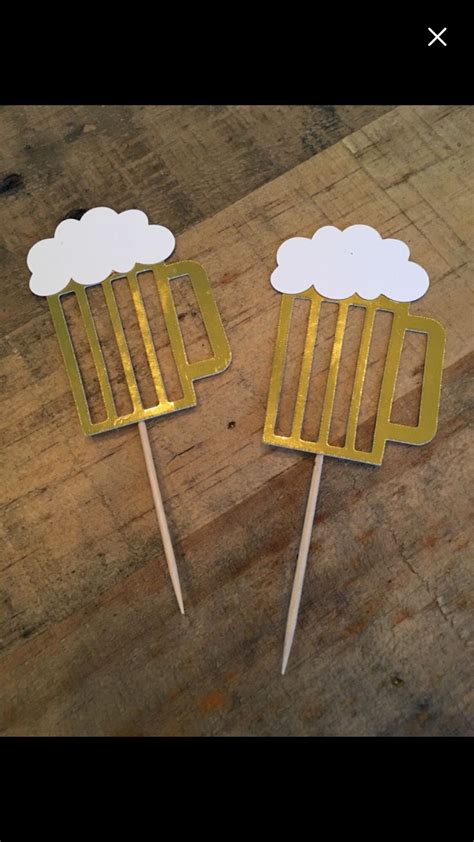 Two Cake Toppers Made To Look Like Beer Mugs With Clouds On Them