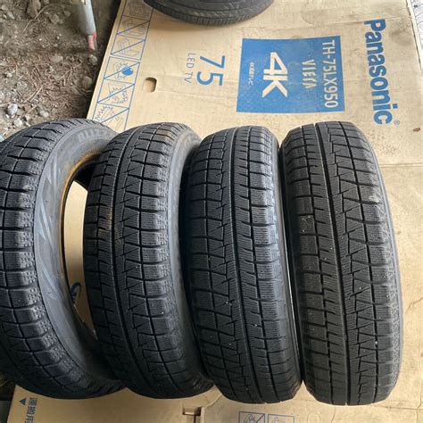 やや傷や汚れあり155 65R14 ブリヂストン ブリザックレボGZ 中古スタッドレスタイヤ4本セット 2016年製 送料無料 残溝ありの