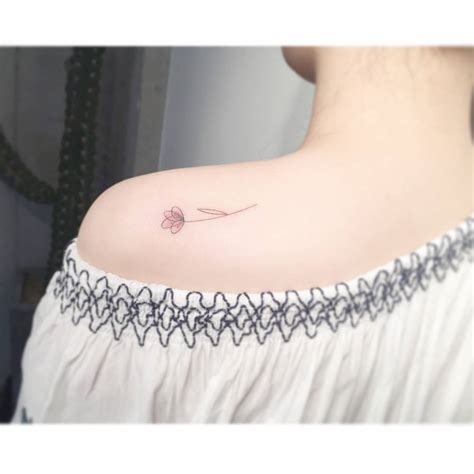 Minimalistic Style Lotus Flower Tattoo Located On The