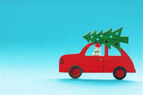 Premium Photo Toy Wooden Red Car With Christmas Tree On The Roof And