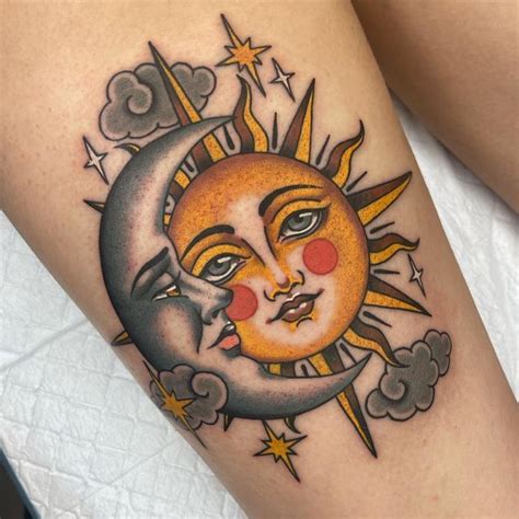 A Sun And Moon Tattoo On The Thigh With Clouds In The Sky Behind It