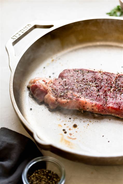 The Perfect 3 Minute Cast Iron Steak Recipe Plays Well With Butter