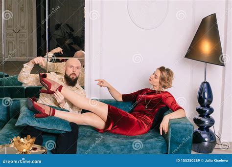A Handsome Man Kissing A Woman S Foot In Red Shoes Stock Image Image