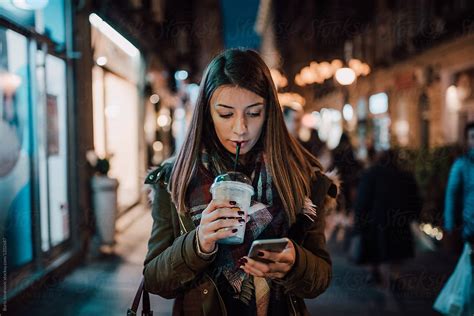 Woman Using A Mobile Phone In The City By Stocksy Contributor Boris