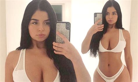 Demi Rose Flaunts Her Ample Curves In A Skimpy White Thong Bikini