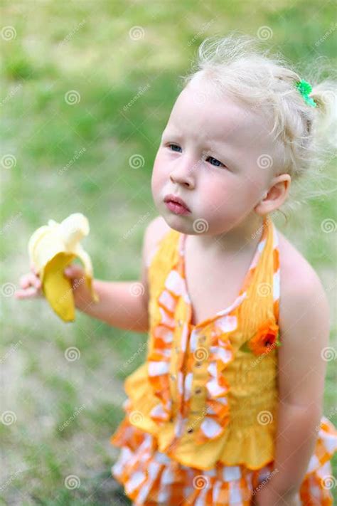 Upset The Girl Eats A Banana Stock Image Image Of Eyes Girl 26059895