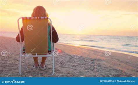 The Girl Sits On A Sun Lounge On The Beach Stock Video Video Of Beams Relaxation 257680055