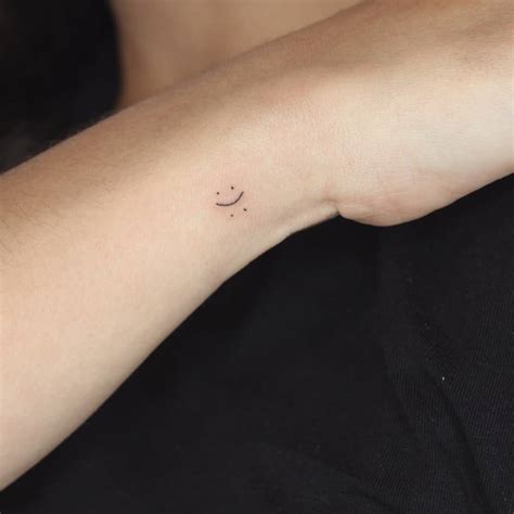 Minimalistic Style Smiley Tattoo Located On The Wrist