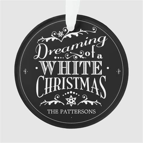 A Black And White Ornament With The Words Dreaming Of A White Christmas
