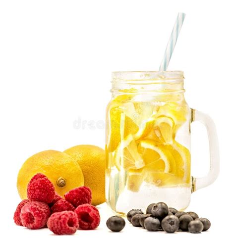Lemonade In A Mason Jar With A Drinking Straw Decorated With Slices Of