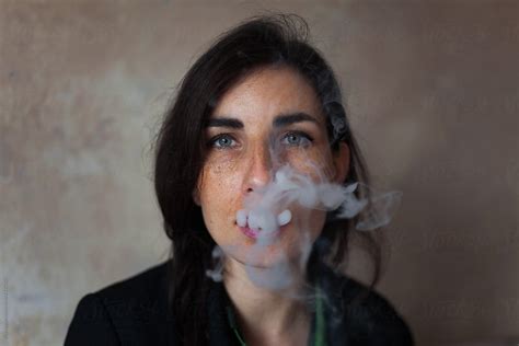 Woman Blowing Smoke