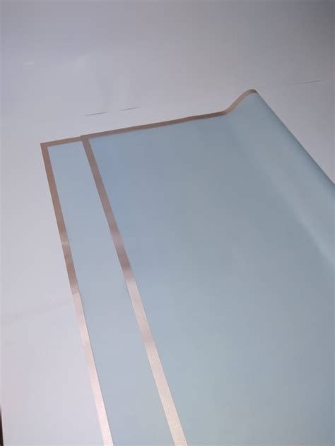 Papel Celofán Ahumado Estampa Lateral Celeste Dorado 20 uds Aqua y