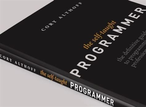 The Book Programmer Is On Display In Front Of A Gray Background With