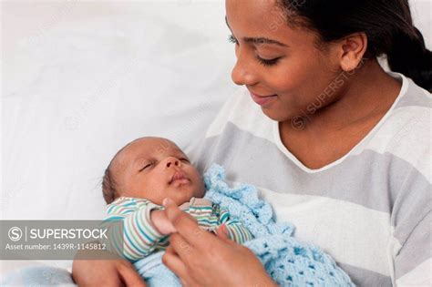 Mother Holding Baby Son SuperStock