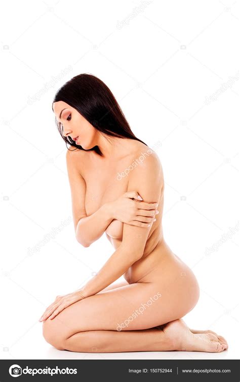 Mujer desnuda arrodillada en el suelo fotografía de stock piotr