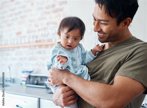 Foto De Down Syndrome Baby And Father Bonding In Their Home With A