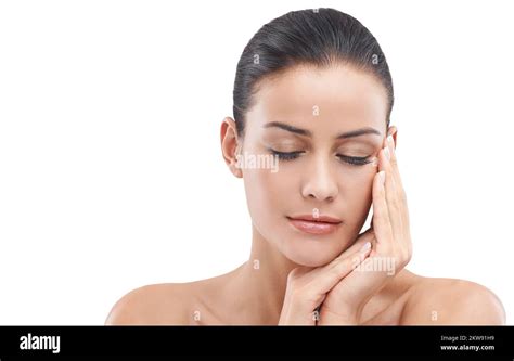 Her Skin Is Silky Smooth A Beautiful Young Woman Rubbing Her Face With Her Eyes Closed Stock