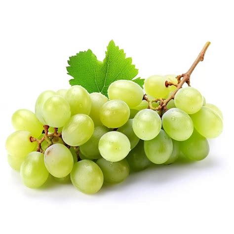 Um Cacho De Uvas Verdes Uma Folha No Topo Foto Premium