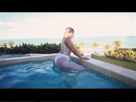 Nicki Minaj Gets Wet In Saucy New Photos