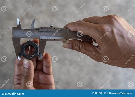 Using Vernier Caliper To Measure Dimensions Of Nut Stock Photo Image