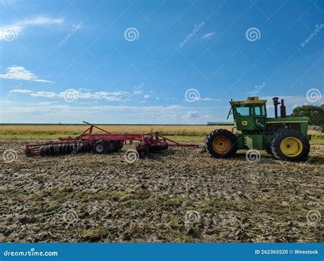 Big Green John Deere Tractor On A Field During Summer Editorial Image