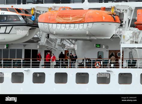 Passengers Stand Next To Lifeboats On Board The Queen Mary 2 Hamburg