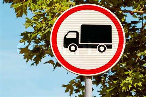 Red And White Round Traffic Sign With Black Cargo Truck Indicating No