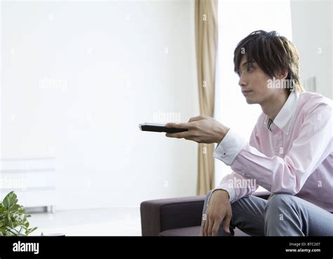 Man Using Remote Control Stock Photo Alamy