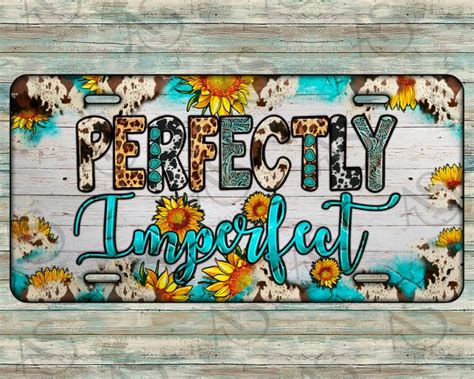 A License Plate With Sunflowers And The Words Perfectly Inked In Blue On It