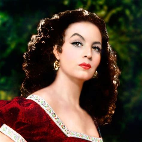 A Woman With Long Hair Wearing A Red Dress In Front Of Trees And Text