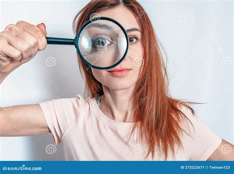 Magnifying Glass Cute Woman Holds A Magnifying Glass Near Her Eye