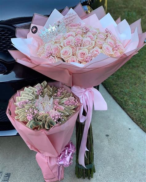 Two Bouquets Of Roses Are Sitting Next To A Car