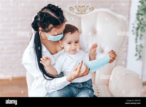Mom With Masked Son Stock Photo Alamy